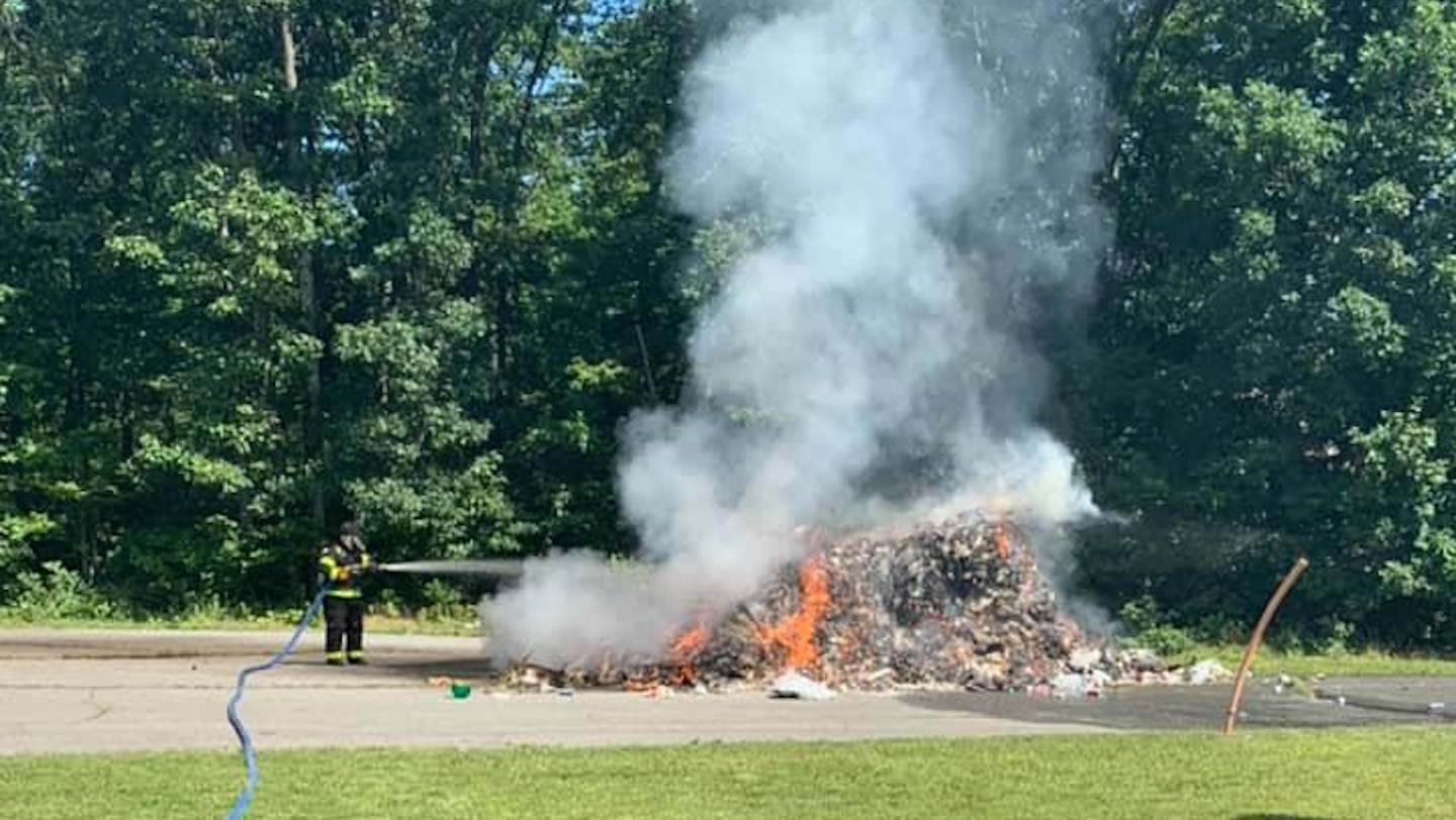 PA Firefighters Tackle Burning Trash Dumped by Garbage Truck Driver ...