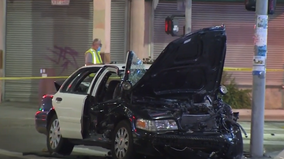 Los Angeles Firefighters Pull Trapped Police Officer from Squad Car ...