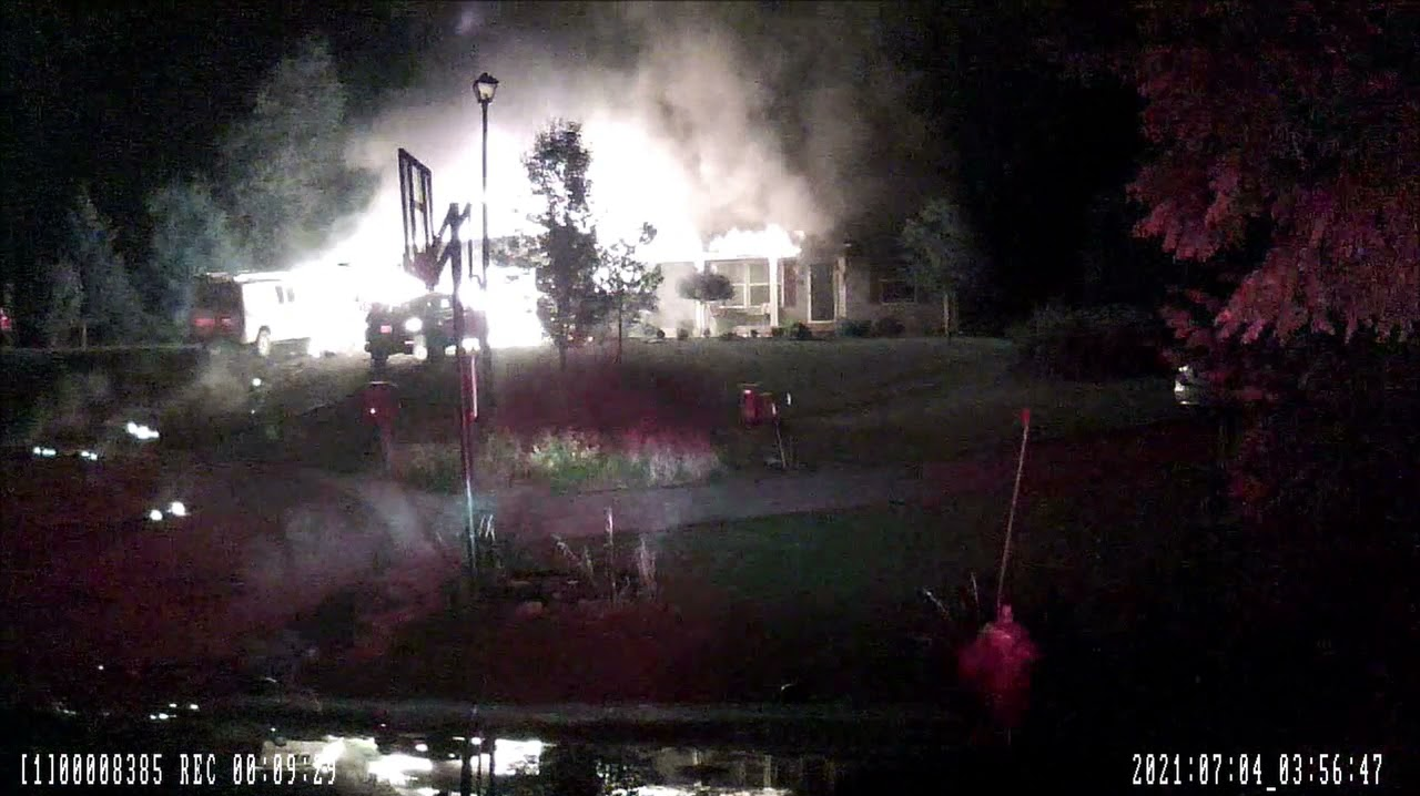 Watch MI Firefighter's Close Call as Burning Garage Explodes | Firehouse