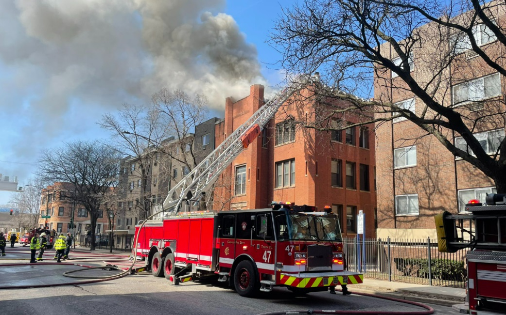 Watch Chicago Firefighters Battle Heavy Flames at Condo Building ...