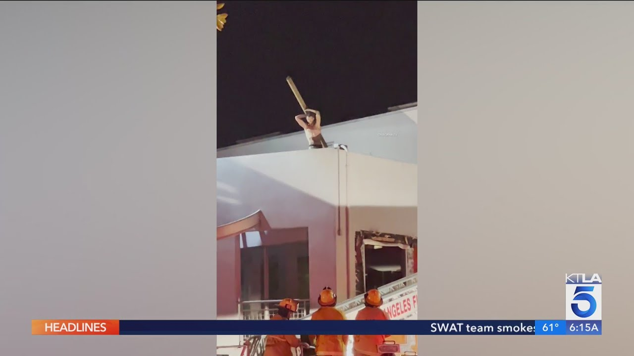 Man on Roof Tosses Wood at Los Angeles, CA Firefighters | Firehouse